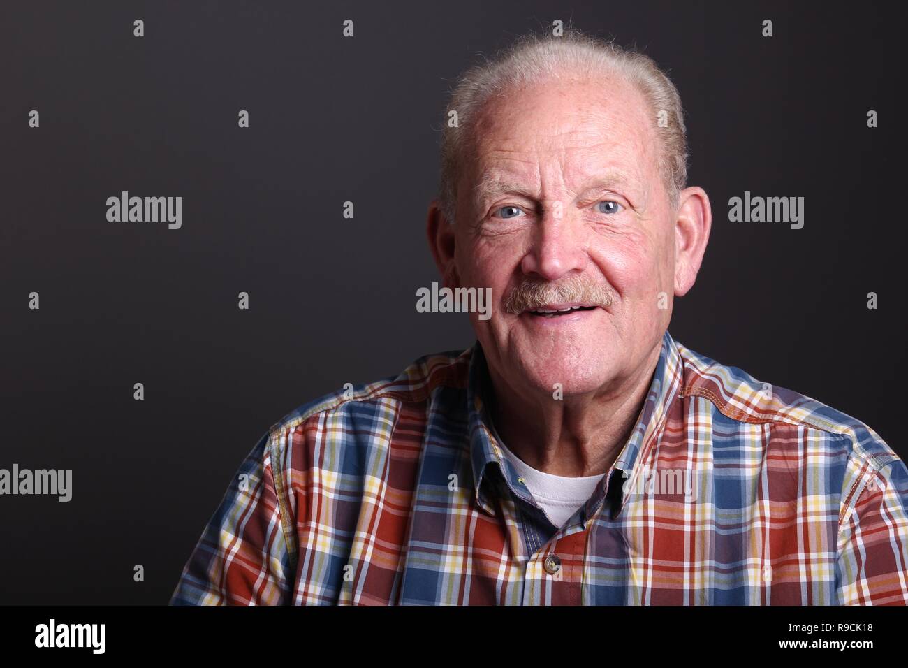 Beautiful old man in front of a background Stock Photo - Alamy