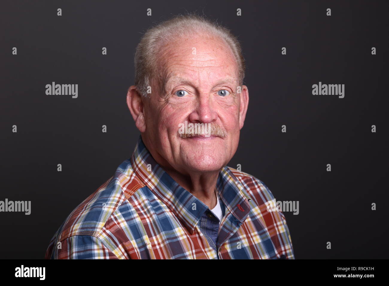 Beautiful old man in front of a background Stock Photo - Alamy