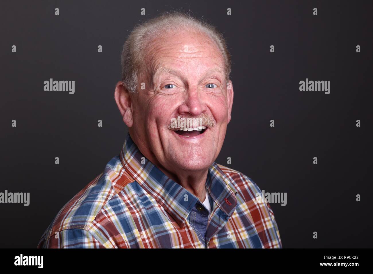 Beautiful old man in front of a background Stock Photo - Alamy
