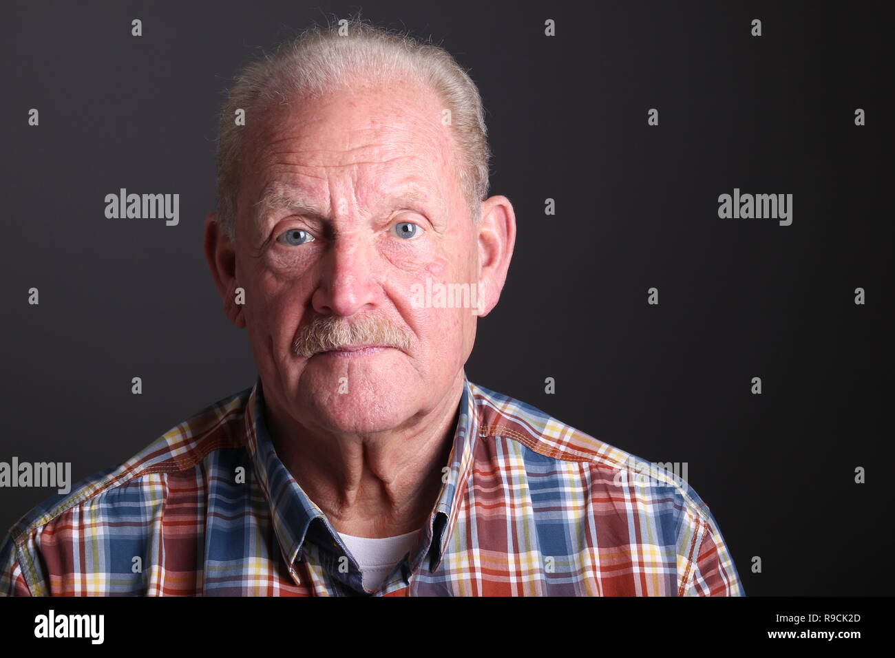 Beautiful old man in front of a background Stock Photo - Alamy