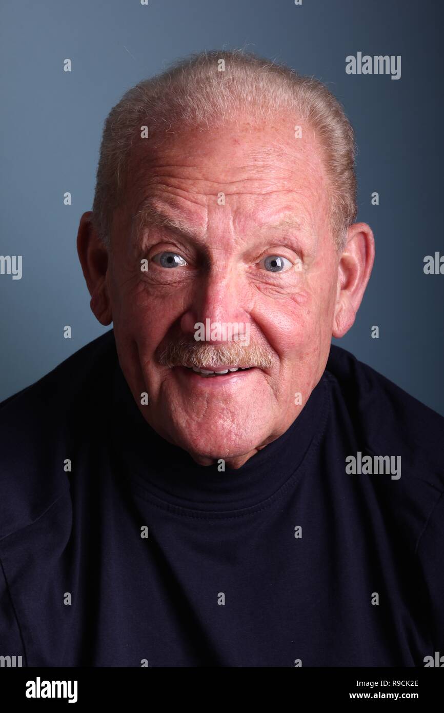Beautiful old man in front of a background Stock Photo - Alamy