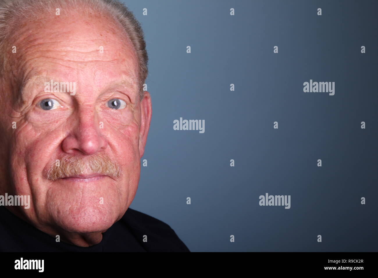 Beautiful old man in front of a background Stock Photo - Alamy