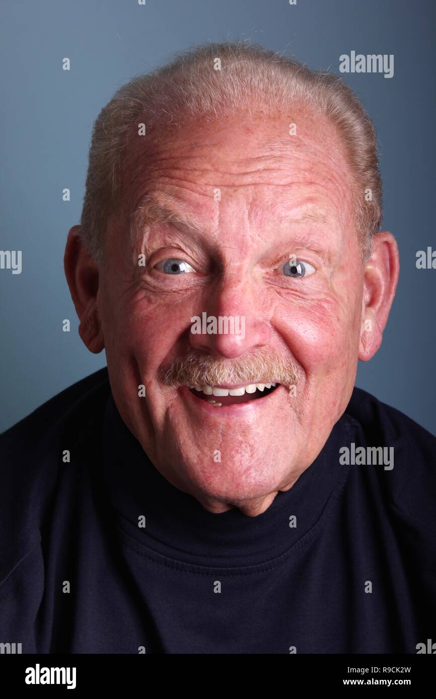 Beautiful old man in front of a background Stock Photo - Alamy