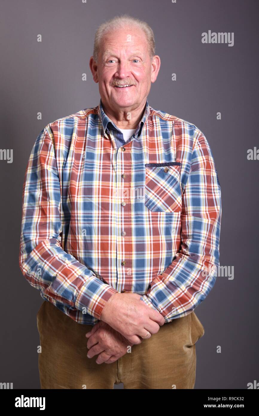 Beautiful old man in front of a background Stock Photo - Alamy