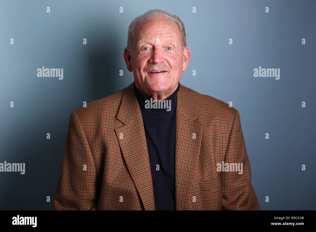Beautiful old man in front of a background Stock Photo - Alamy