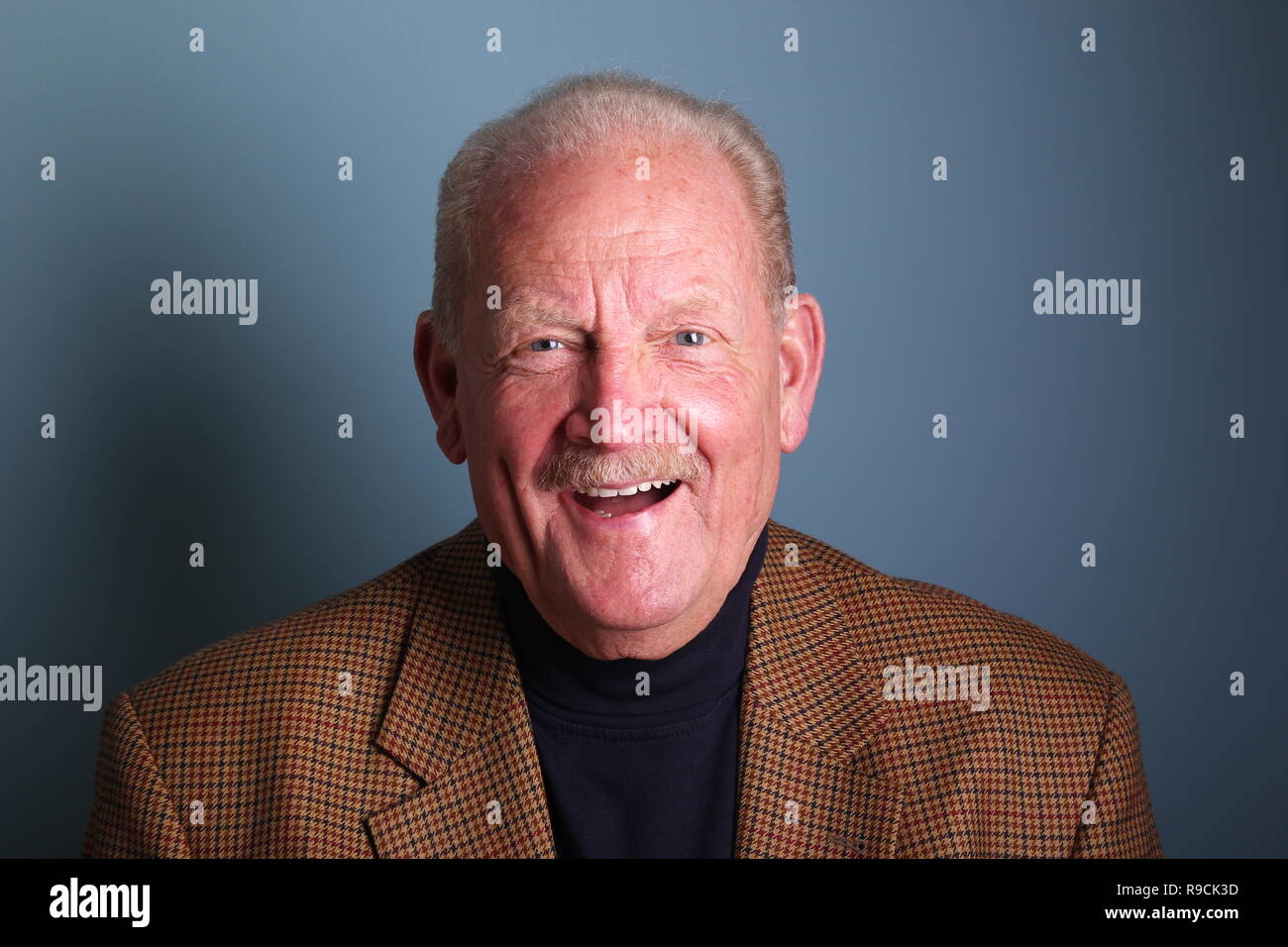 Beautiful old man in front of a background Stock Photo - Alamy