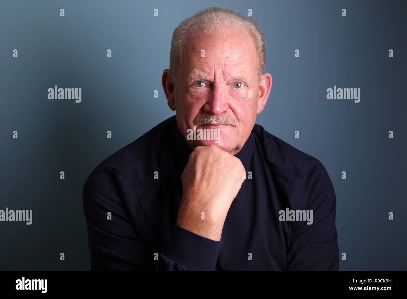 Beautiful old man in front of a background Stock Photo - Alamy