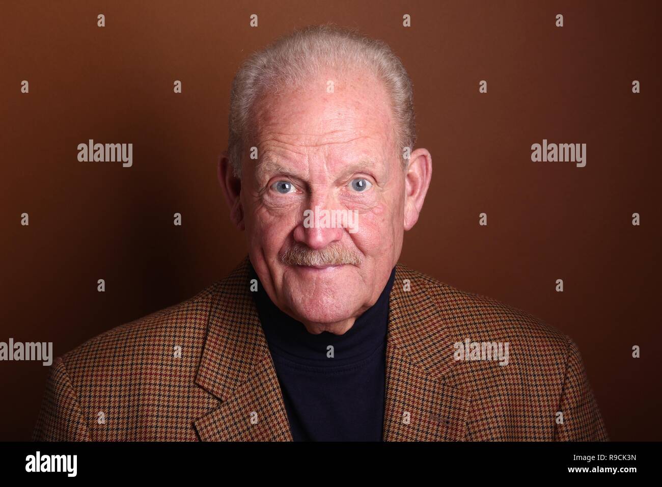 Beautiful old man in front of a background Stock Photo - Alamy