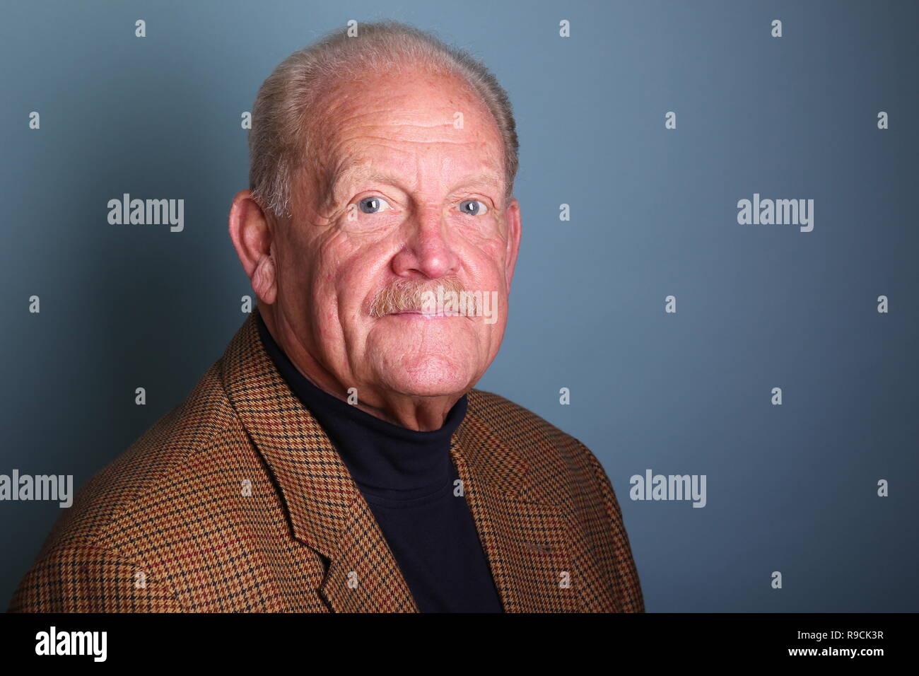 Beautiful old man in front of a background Stock Photo - Alamy