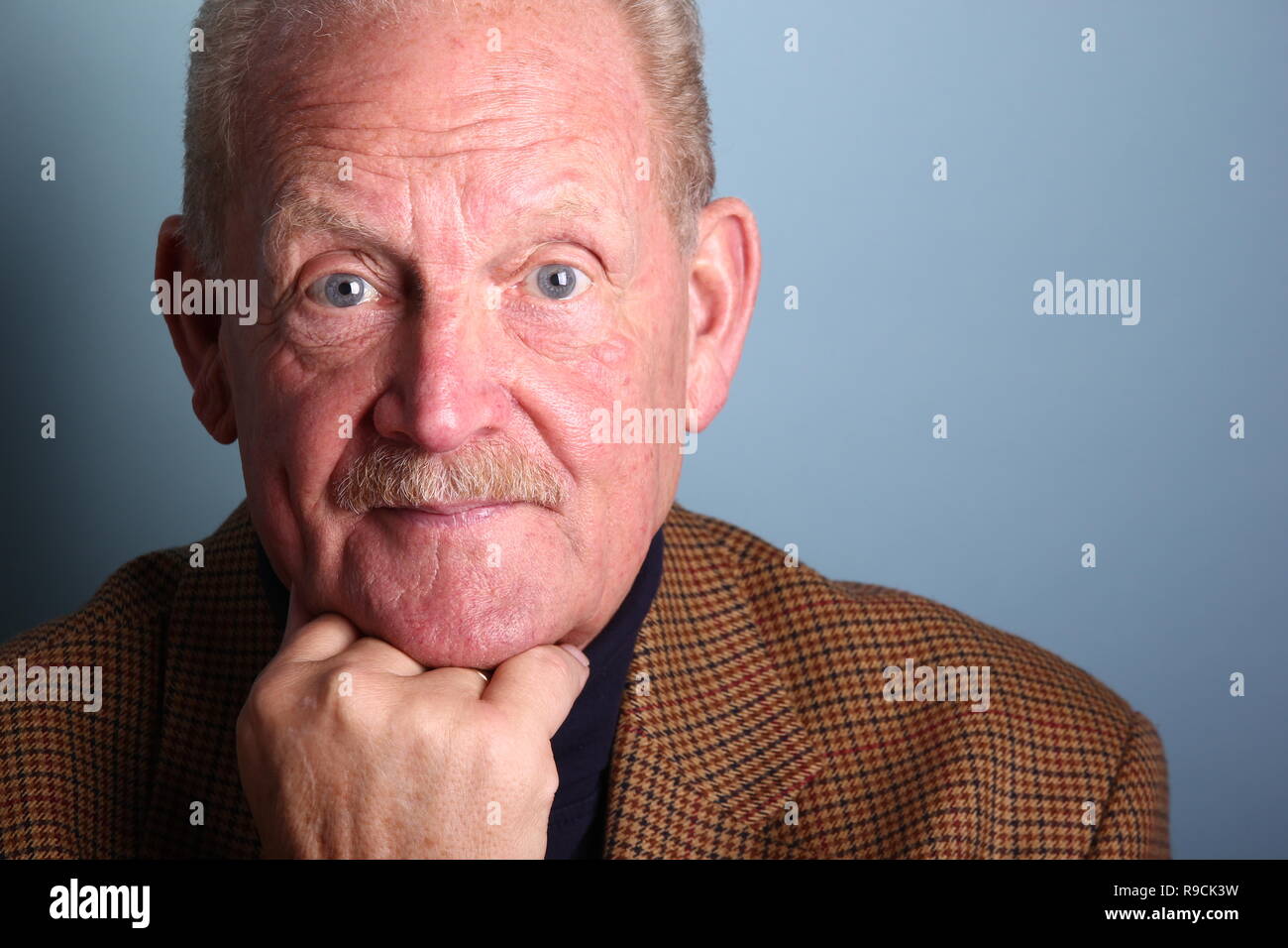 Beautiful old man in front of a background Stock Photo - Alamy