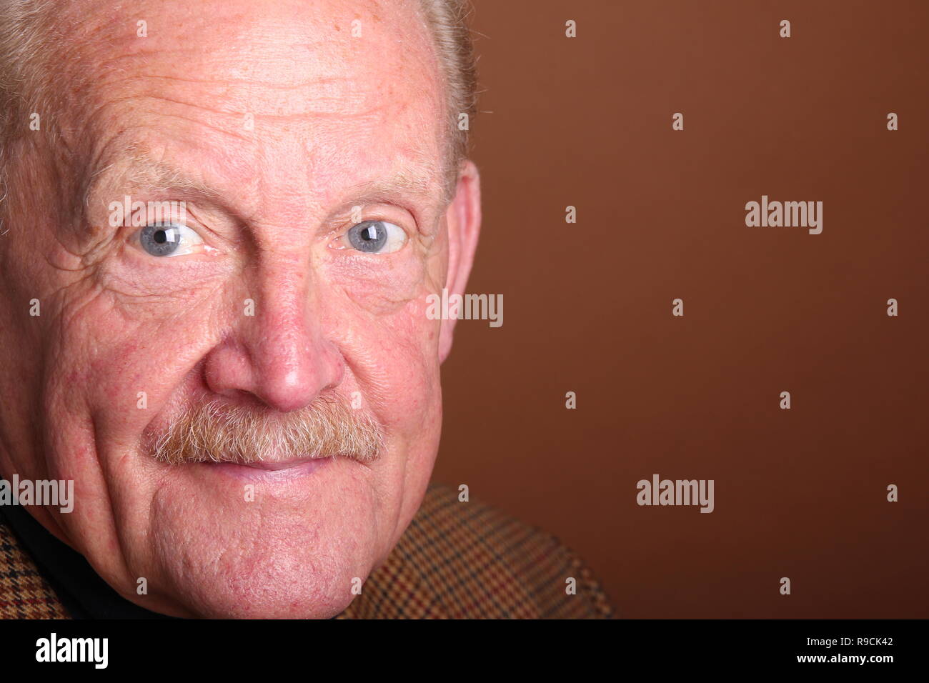 Beautiful old man in front of a background Stock Photo - Alamy