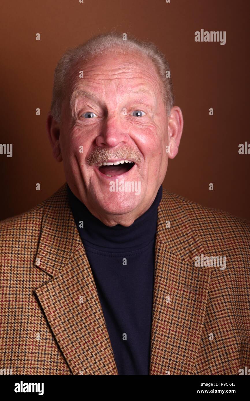Beautiful old man in front of a background Stock Photo - Alamy