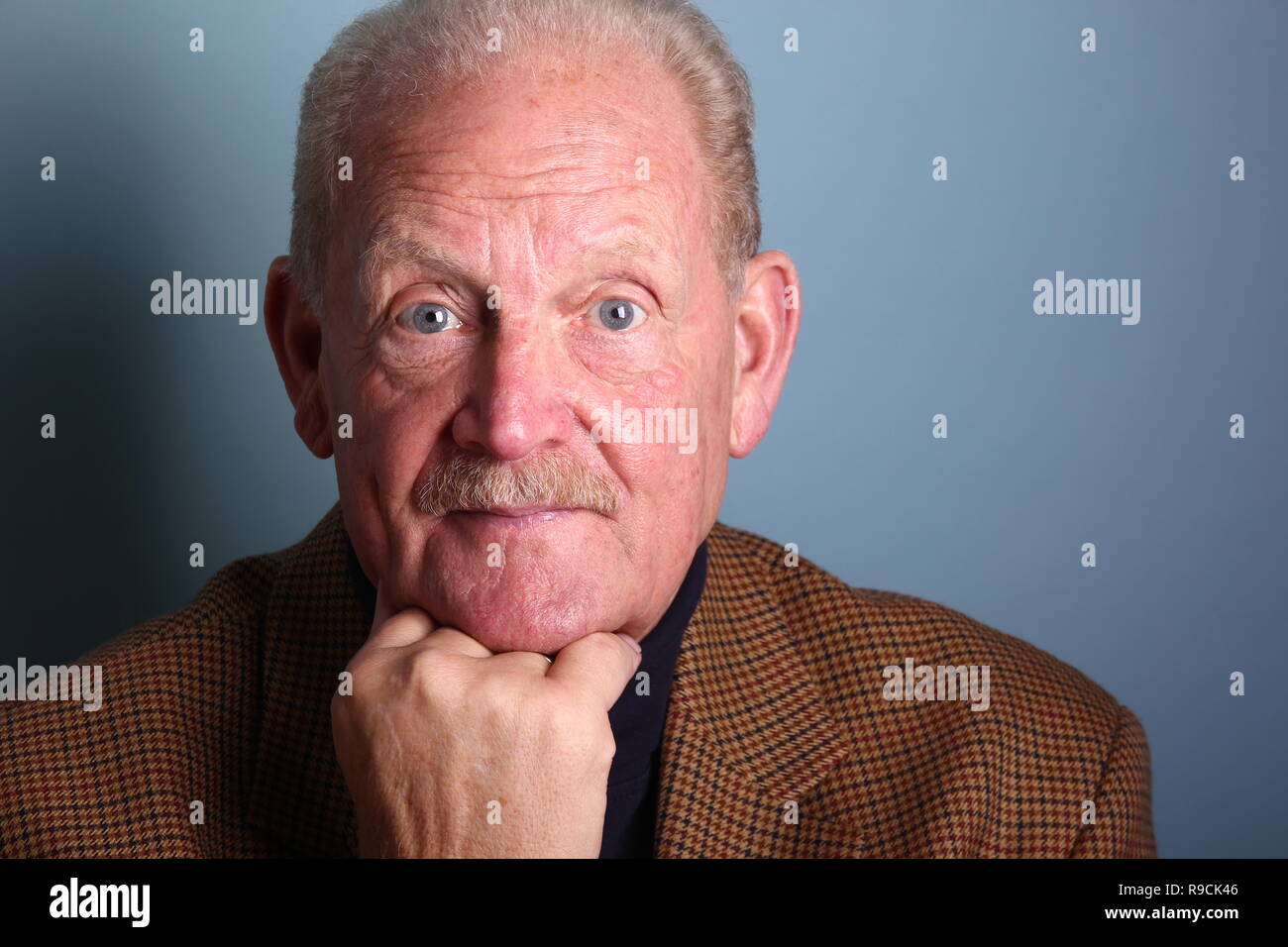Beautiful old man in front of a background Stock Photo - Alamy