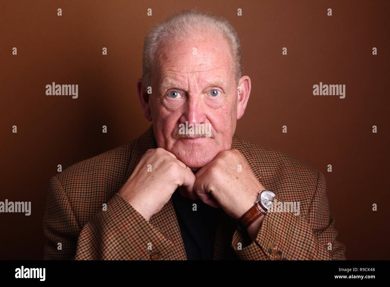 Beautiful old man in front of a background Stock Photo - Alamy
