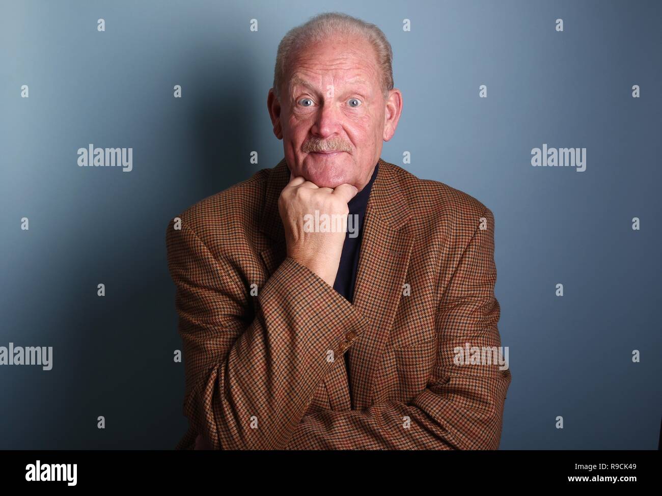 Beautiful old man in front of a background Stock Photo - Alamy