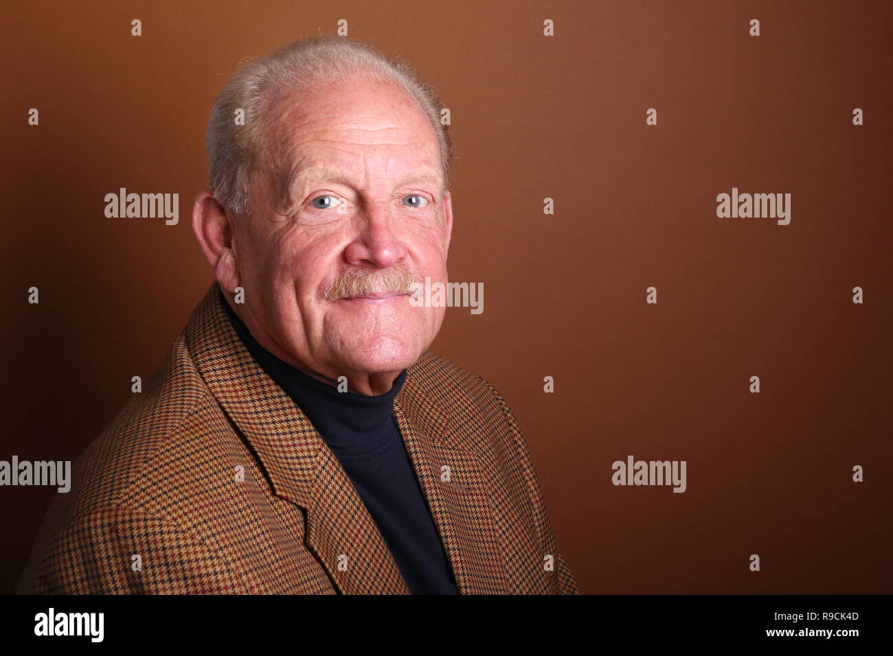 Beautiful old man in front of a background Stock Photo - Alamy