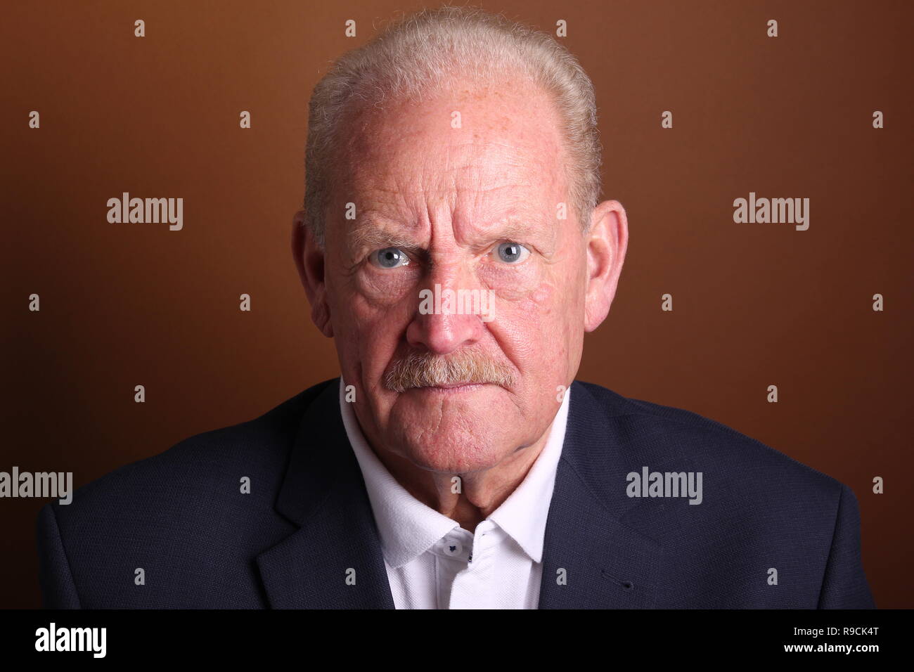 Beautiful old man in front of a background Stock Photo - Alamy