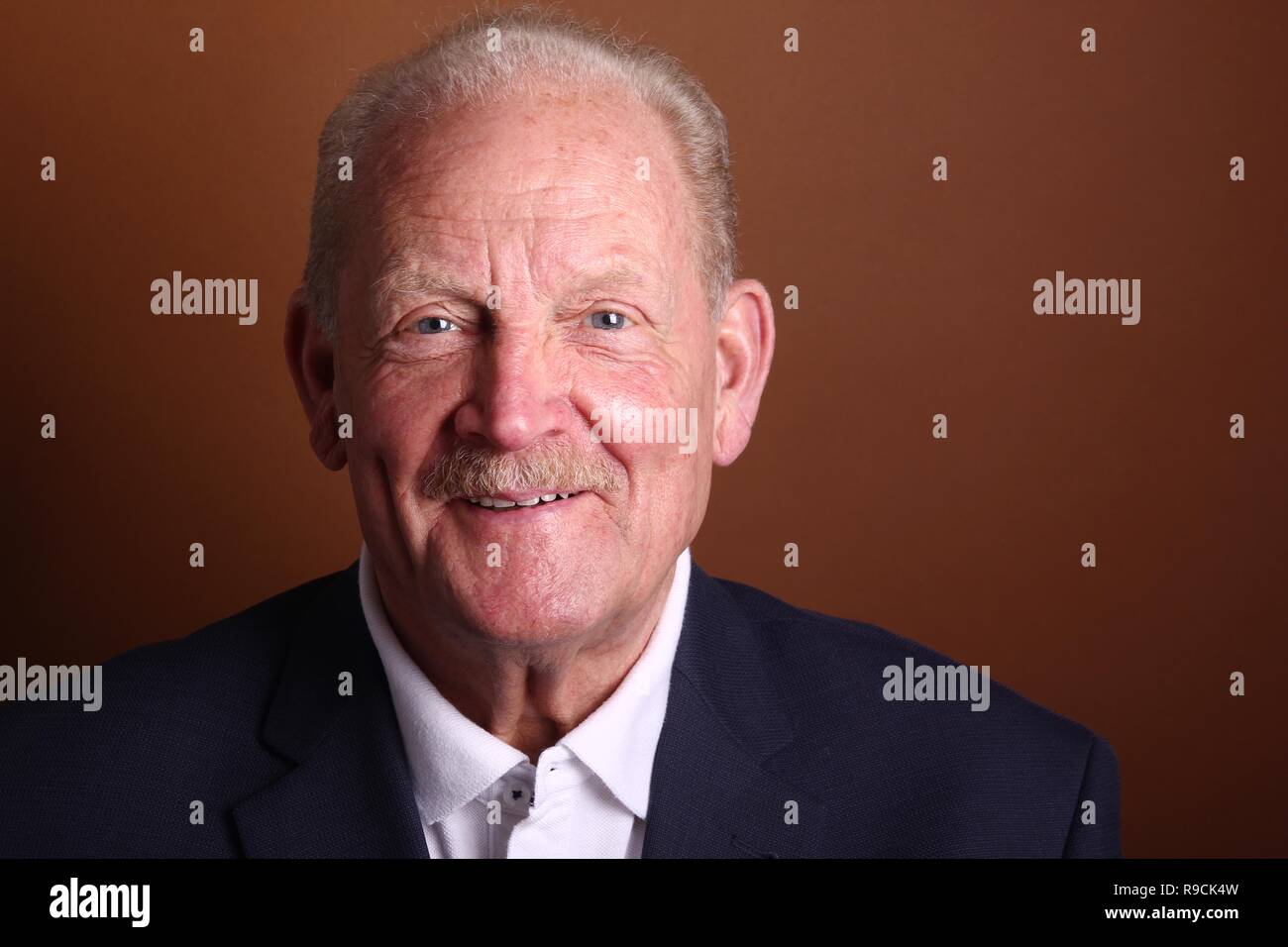 Beautiful old man in front of a background Stock Photo - Alamy