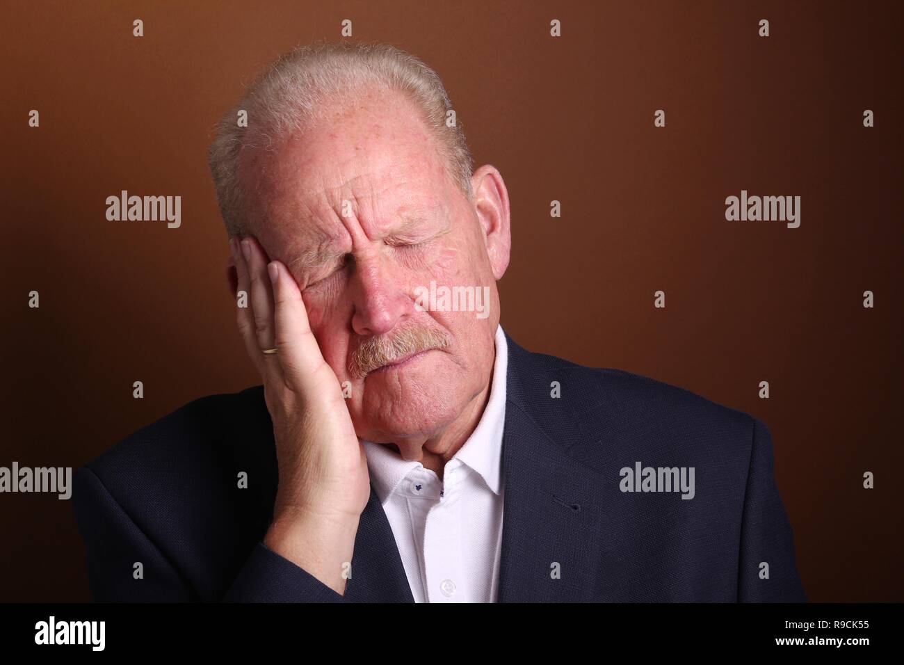 Beautiful old man in front of a background Stock Photo - Alamy