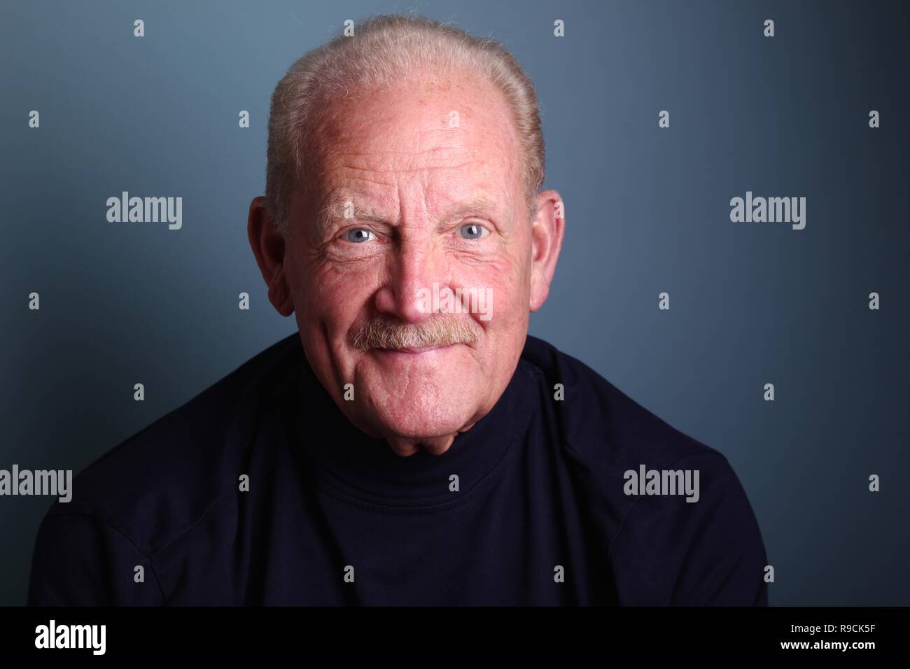 Beautiful old man in front of a background Stock Photo - Alamy