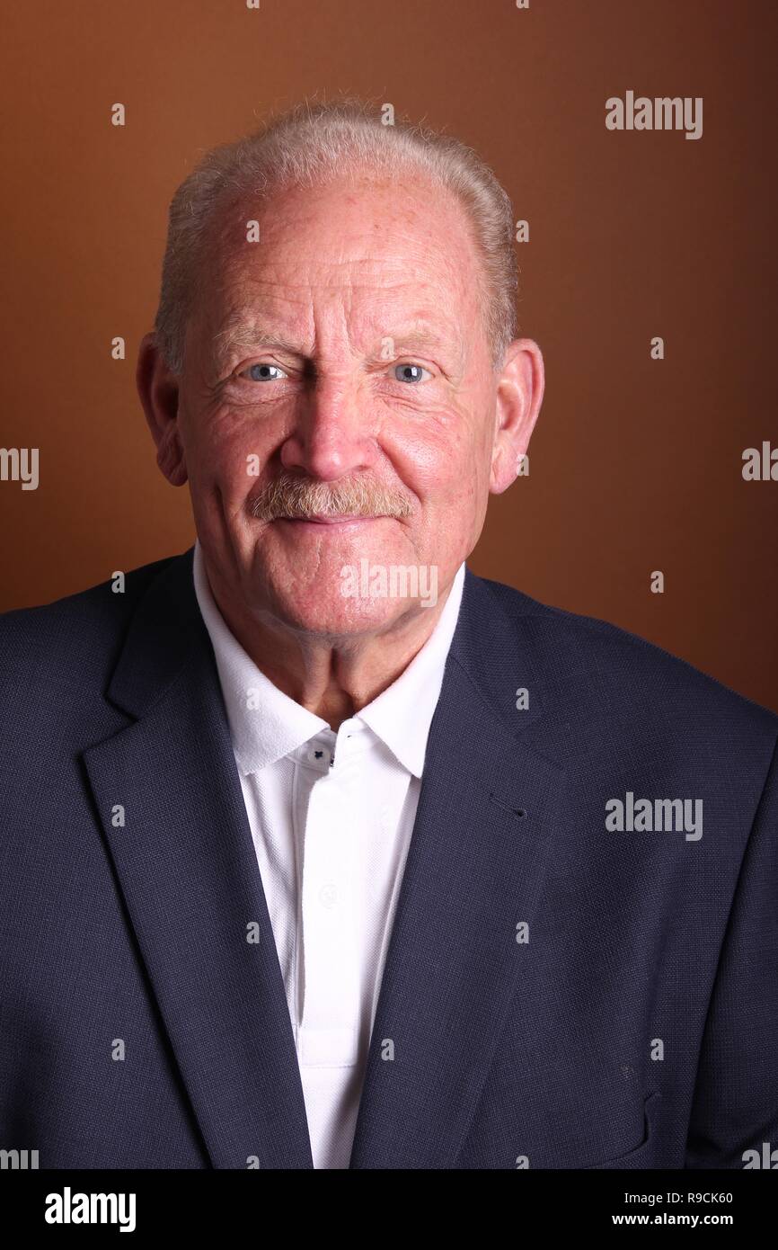 Beautiful old man in front of a background Stock Photo - Alamy