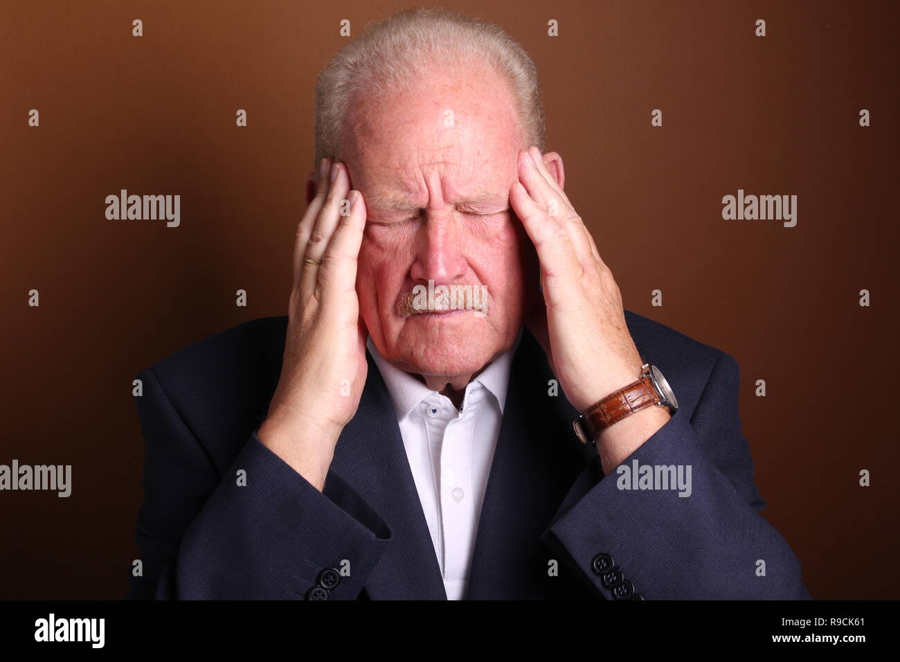 Beautiful old man in front of a background Stock Photo - Alamy