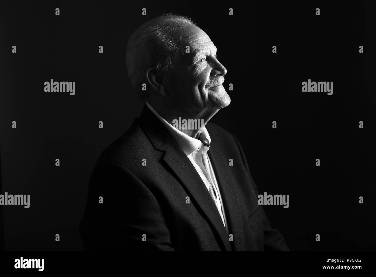Beautiful old man in front of a background Stock Photo - Alamy