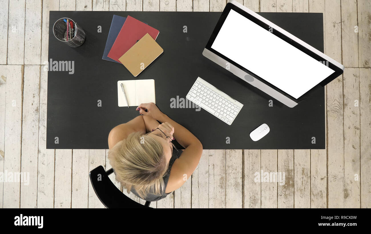 Girl watching on screen of computer. White Display Stock Photo - Alamy