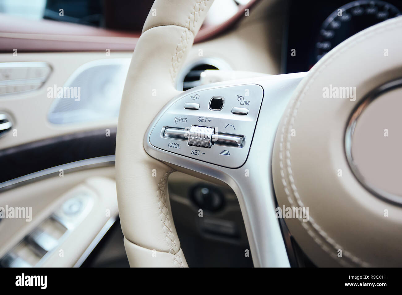 Control buttons on steering wheel. Car interior Stock Photo - Alamy