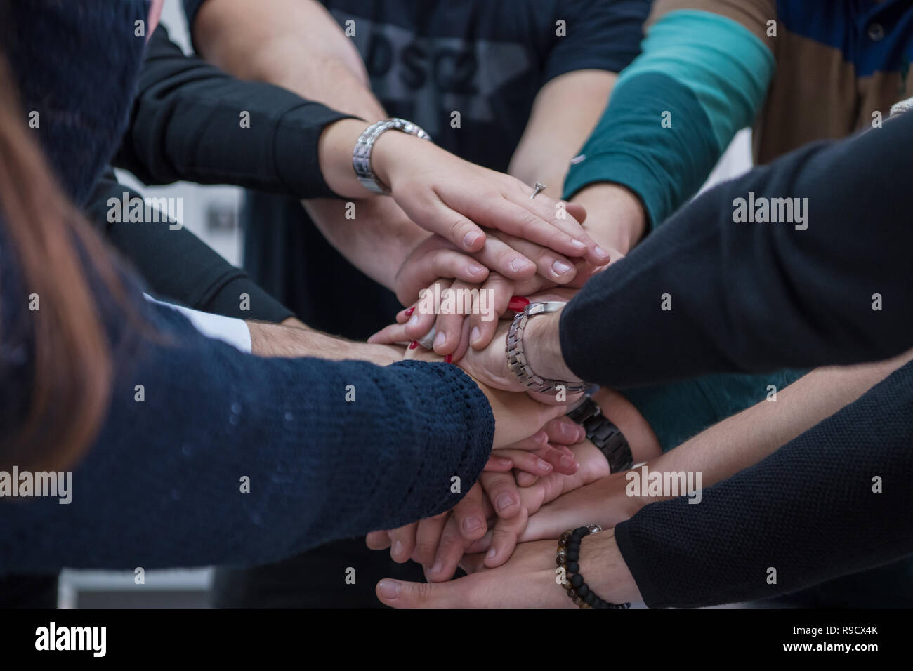 Group of young students in electronics classroom celebrating ...