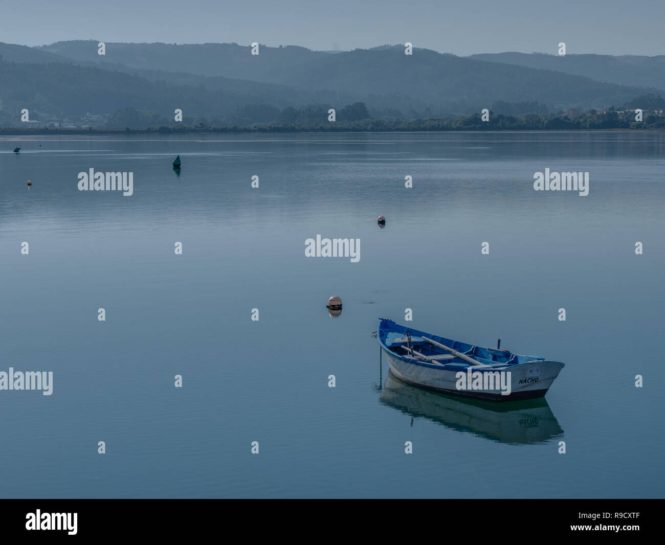 Empty rowboat in water hi-res stock photography and images - Alamy