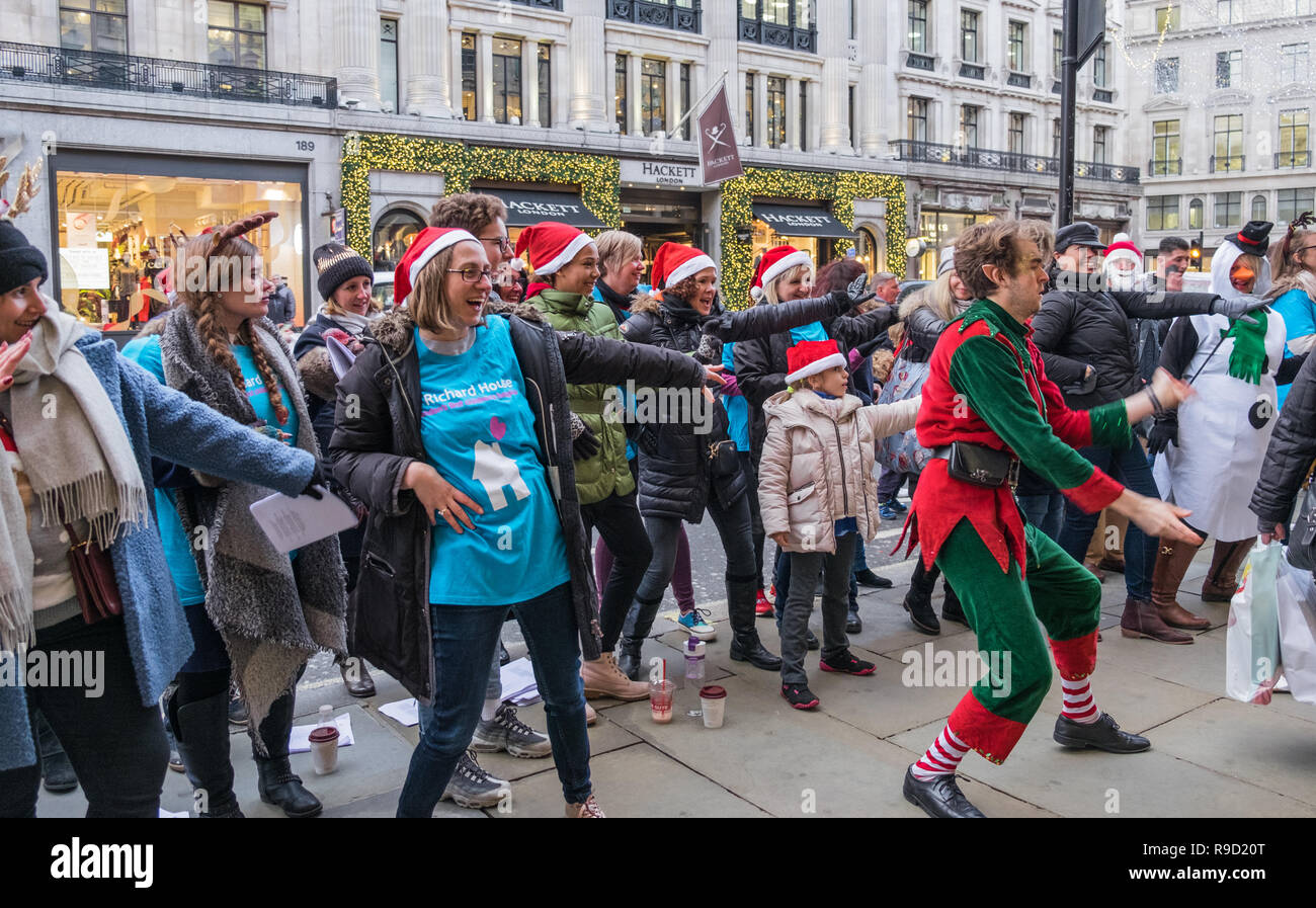Hamleys’ Elf Mike Rogers impromptu dances with volunteers from London’s ...