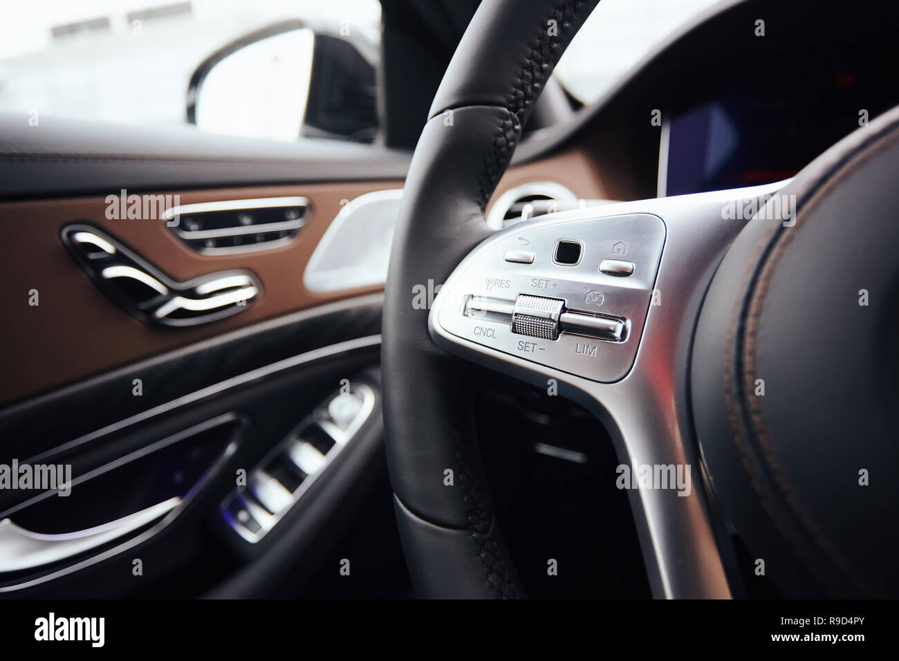 Control buttons on steering wheel. Car interior Stock Photo - Alamy