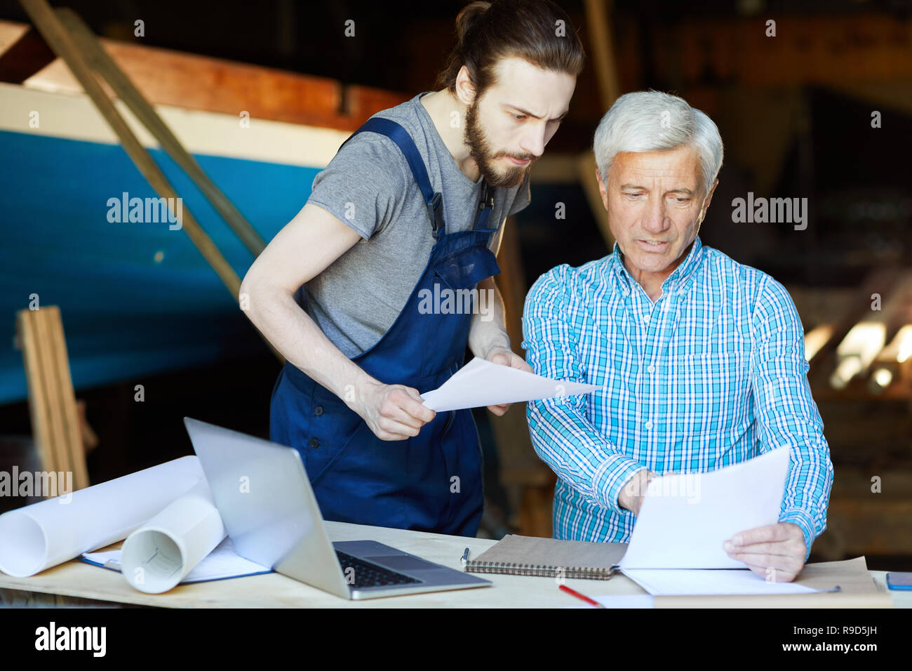 Discussing technical papers Stock Photo - Alamy