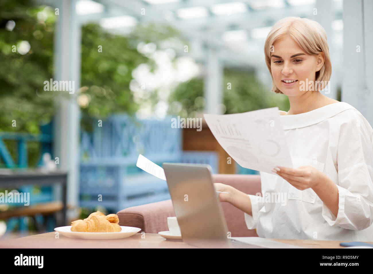Paperwork young woman reading documents hi-res stock photography and ...