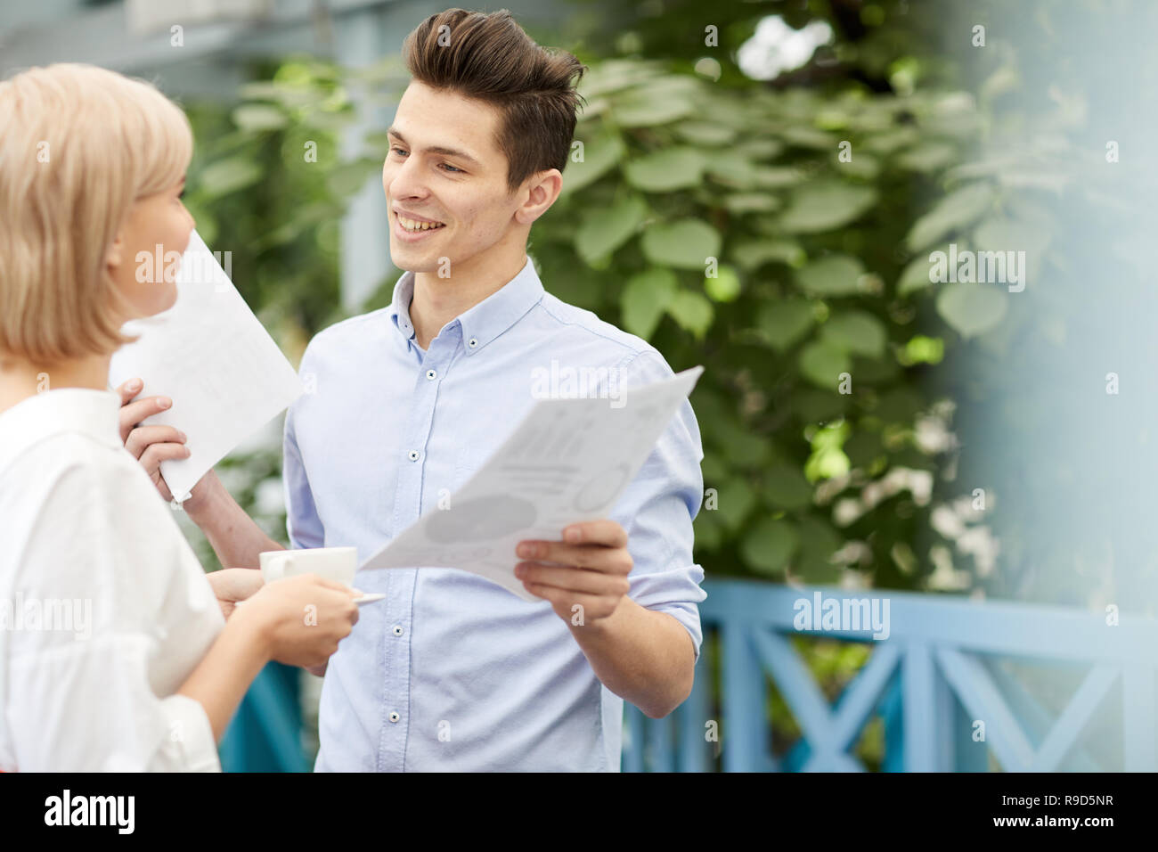 Discussion in summer cafe Stock Photo - Alamy