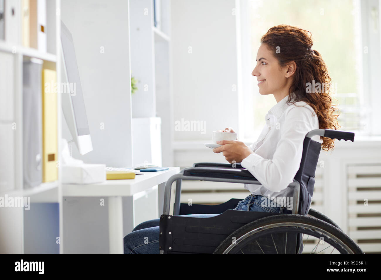 Disable office worker Stock Photo - Alamy