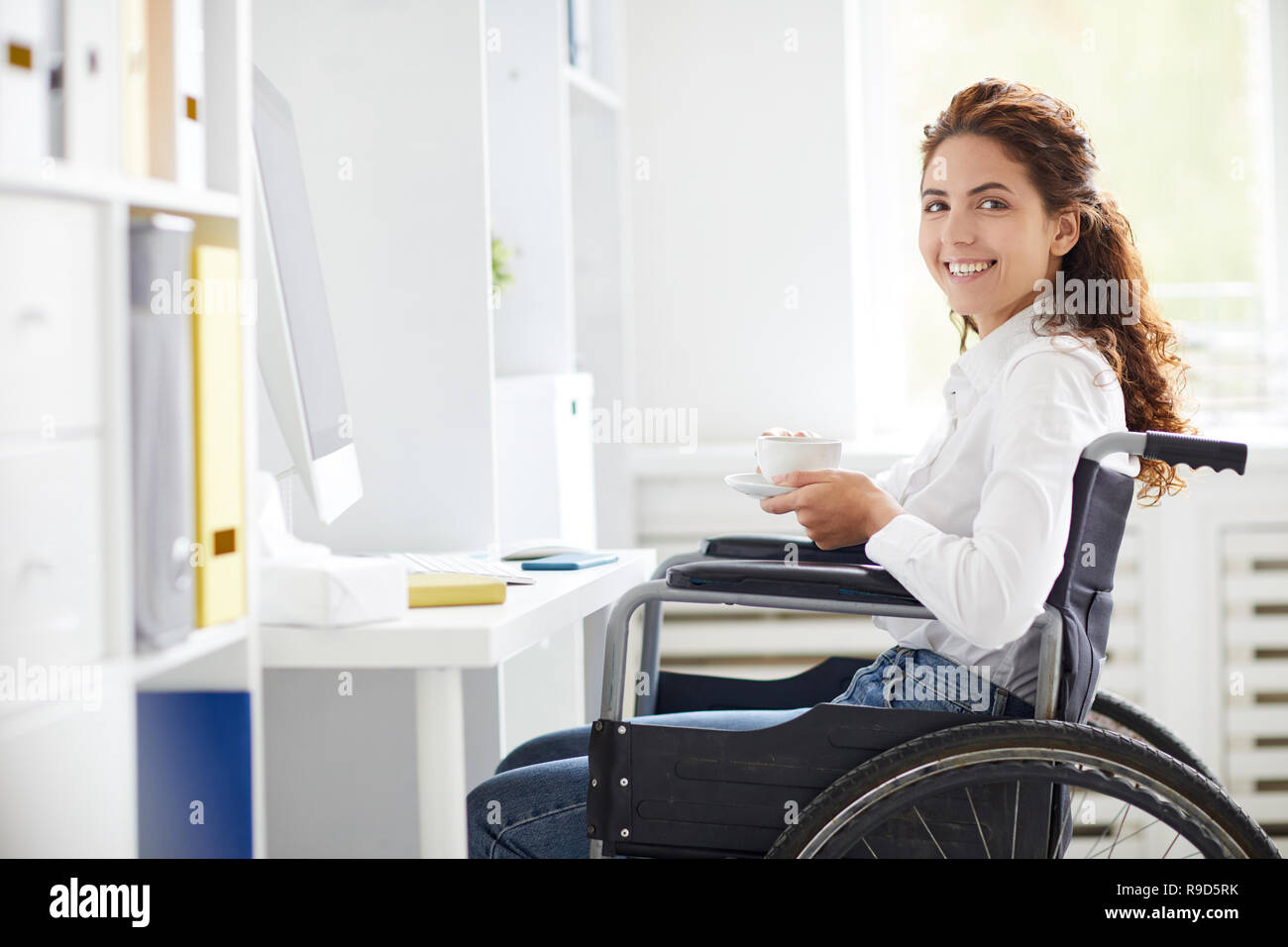 Professional woman in wheelchair hi-res stock photography and images ...
