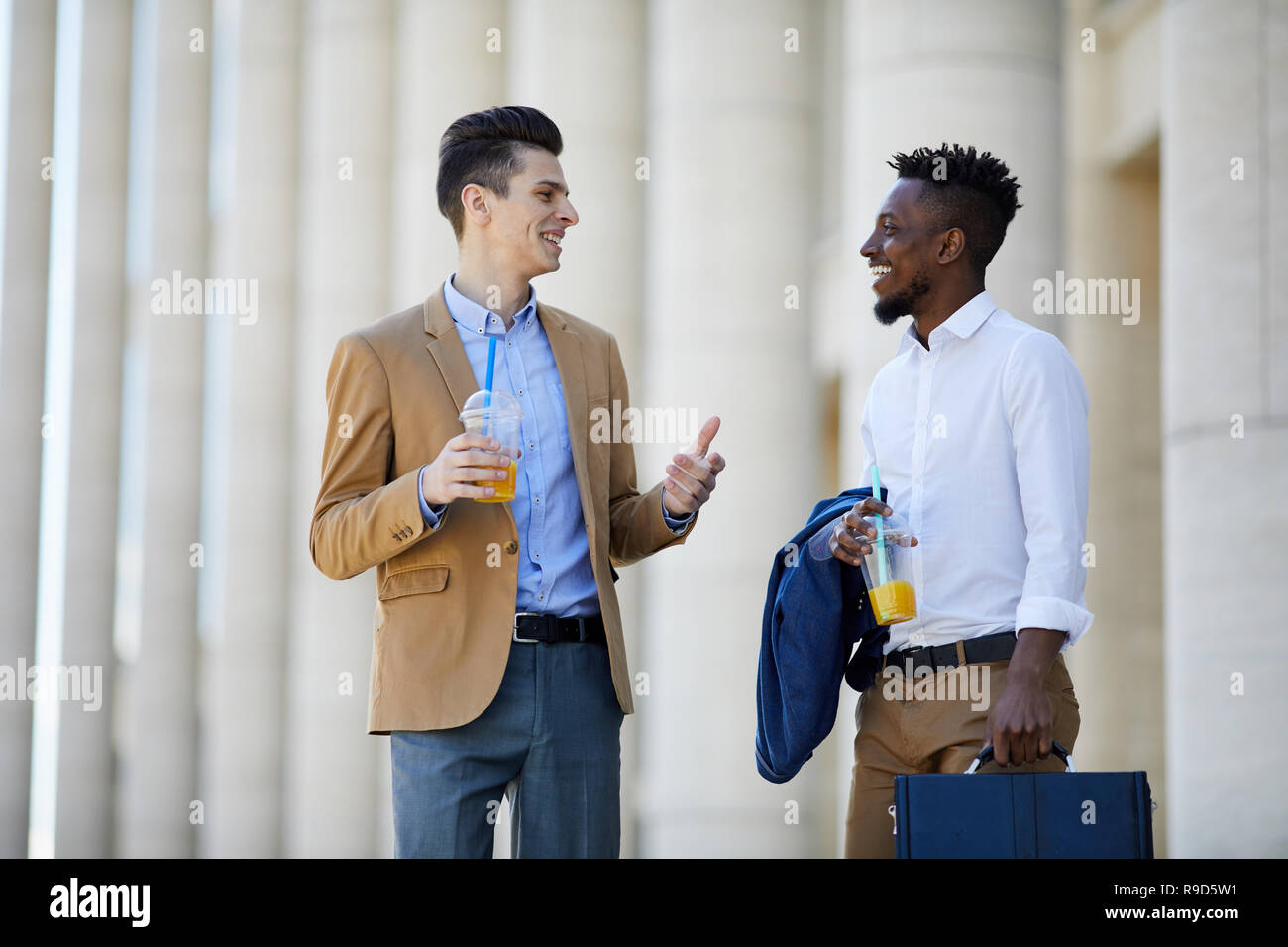 Positive office friends at break Stock Photo - Alamy