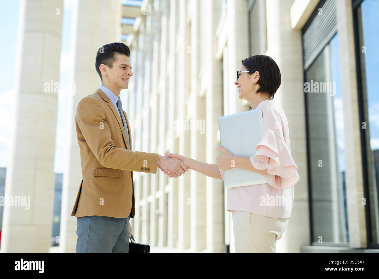 Business woman greeting hi-res stock photography and images - Alamy