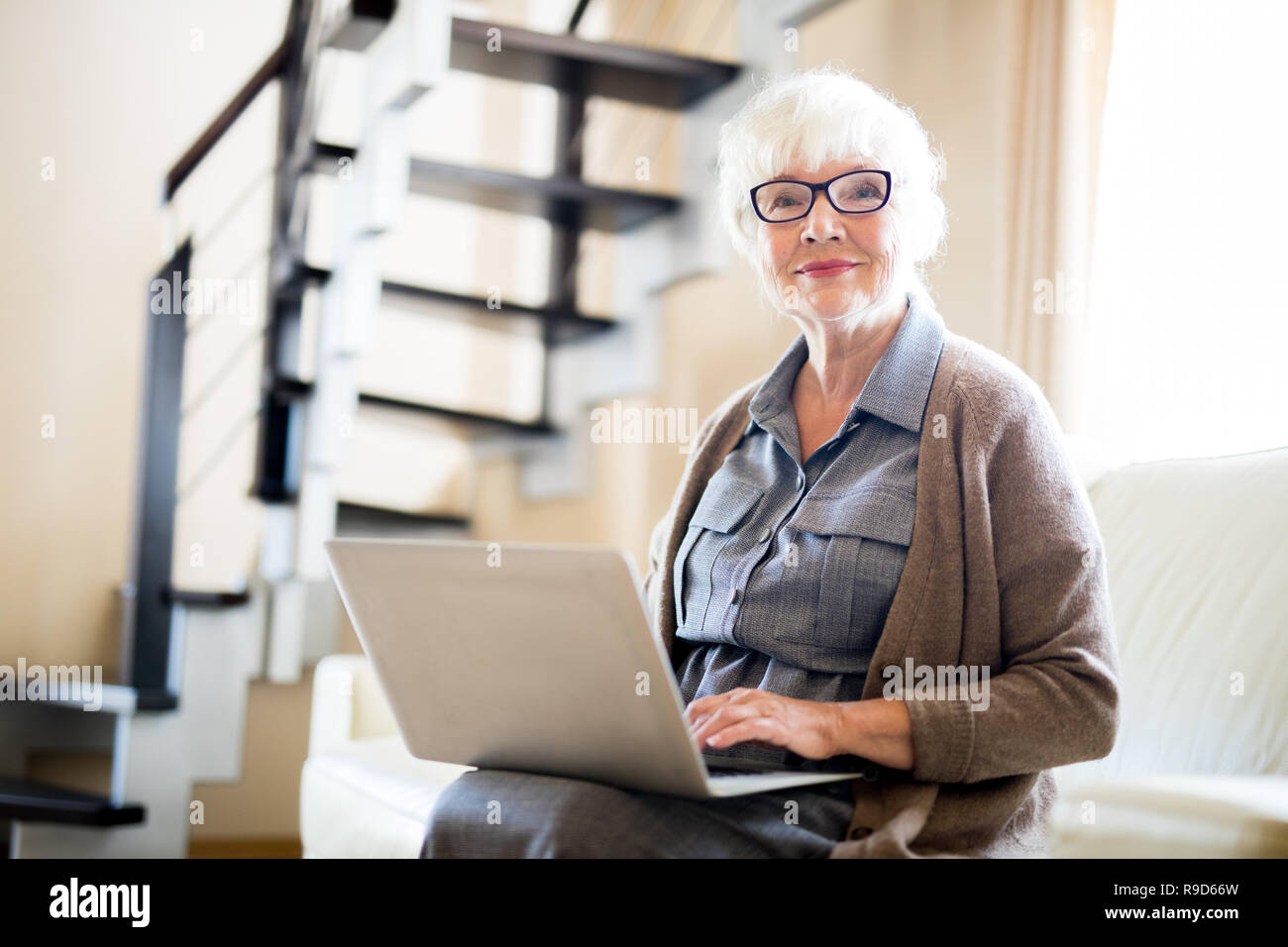 Senior woman networking Stock Photo - Alamy