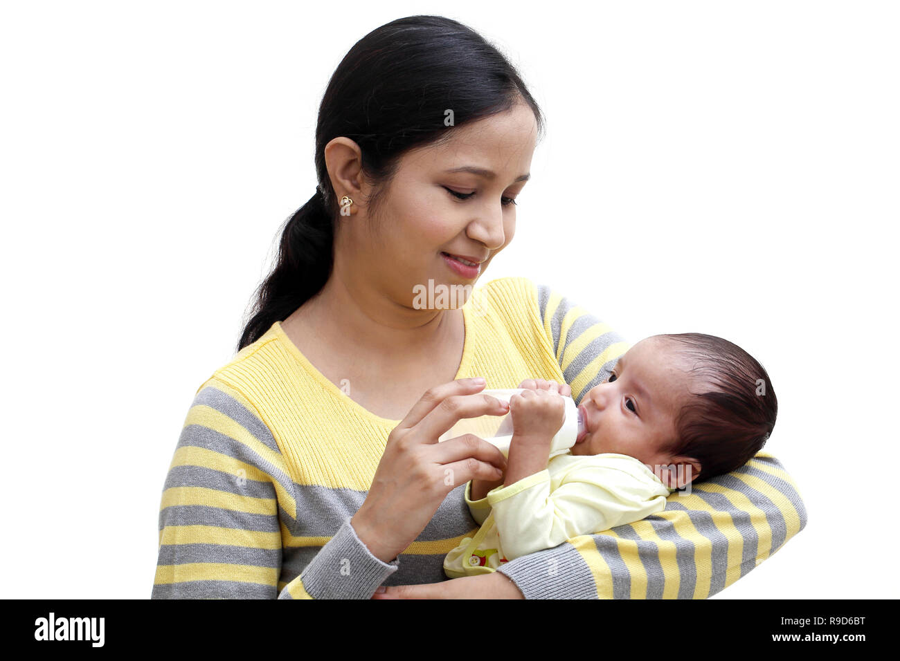 Mother feeding milk to newborn baby Stock Photo - Alamy