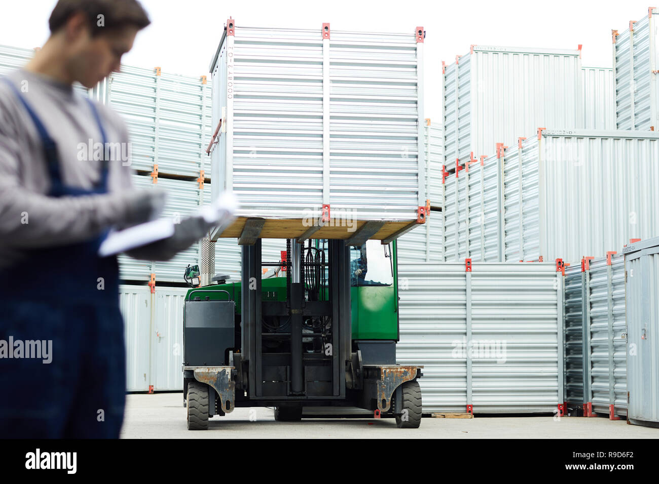 Powerful truck with heavy container Stock Photo - Alamy