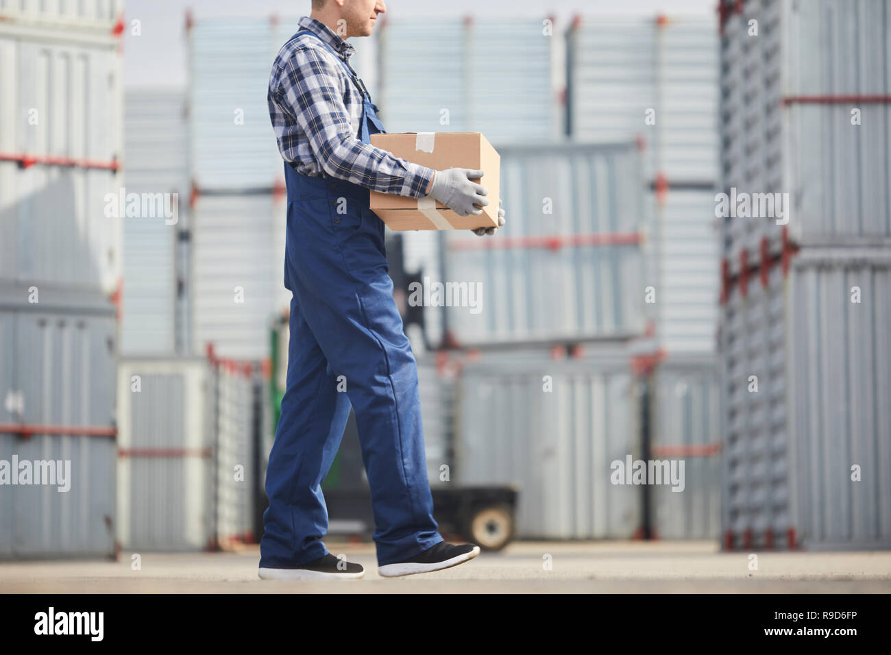 Cargo mover carrying cardboard box Stock Photo - Alamy