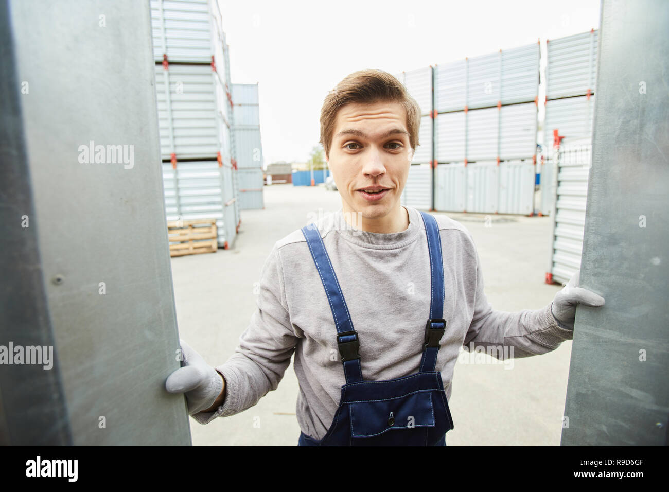 Surprised mover opening metal cargo container Stock Photo - Alamy