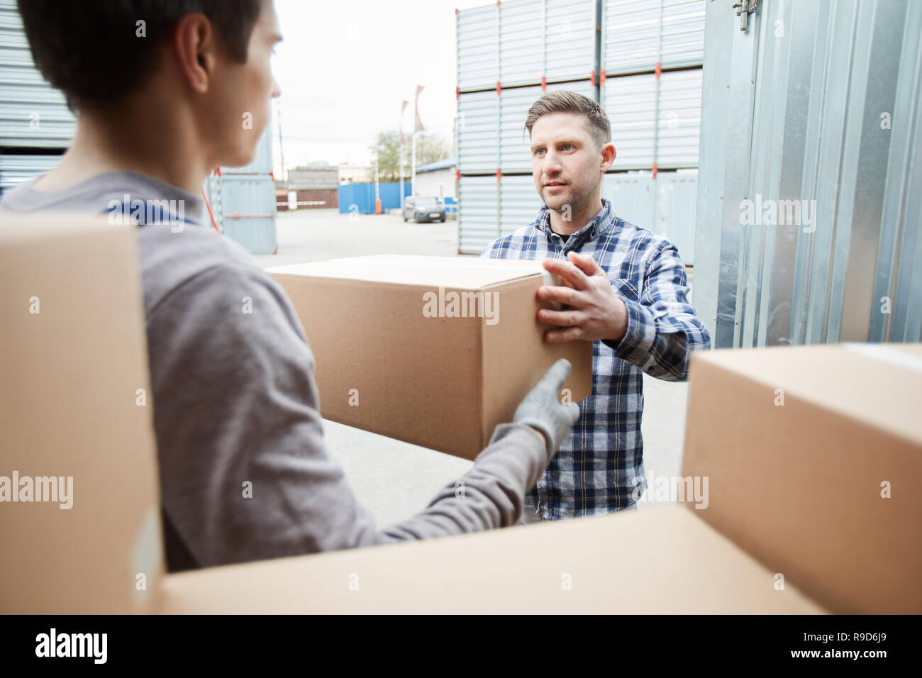 Giving box to client Stock Photo - Alamy