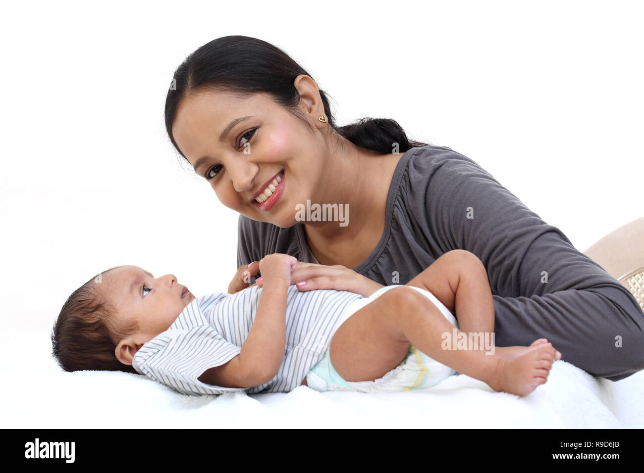 Cheerful mother with newborn baby Stock Photo - Alamy