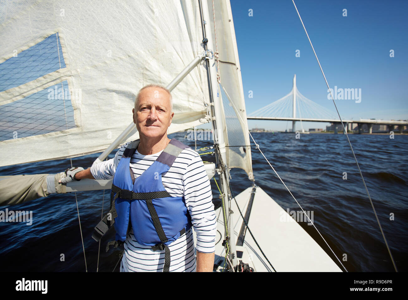 Handsome mature yacht owner in sea Stock Photo - Alamy