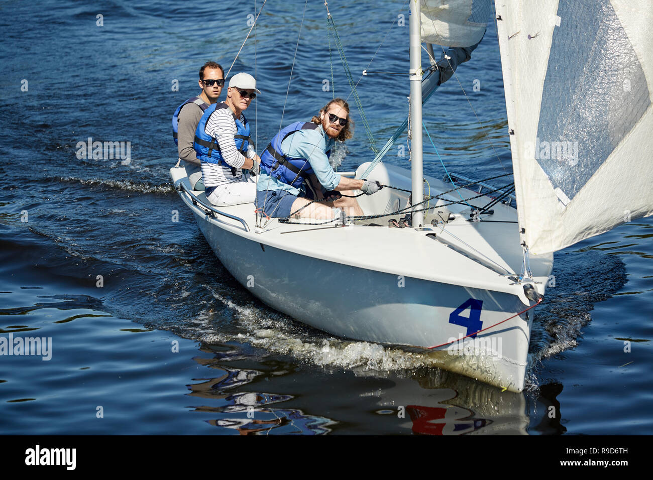 Calm men floating in ocean Stock Photo - Alamy