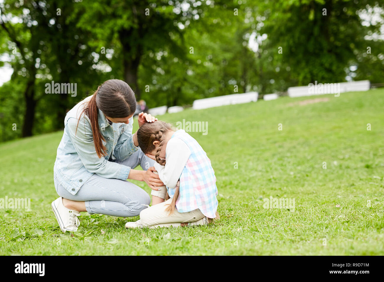 Mother comforting crying child hi-res stock photography and images - Alamy